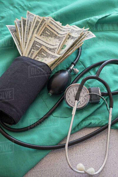 Studio Shot Of Blood Pressure Monitor With Money Stock Photo Dissolve studio-shot-of-blood-pressure-monitor-with-money-stock-photo-dissolve