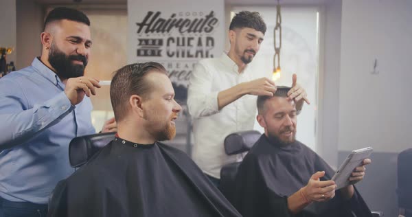 Clients communicating in barber shop during haircut - Stock Video ...