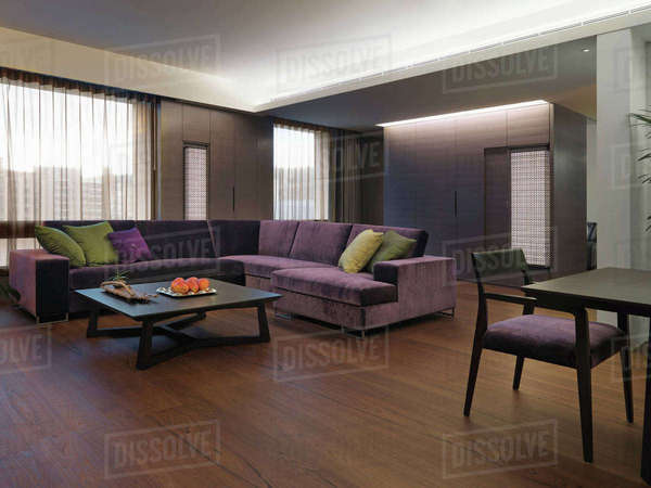 Purple sectional sofa in modern living room - Royalty-free Stock Photo ...