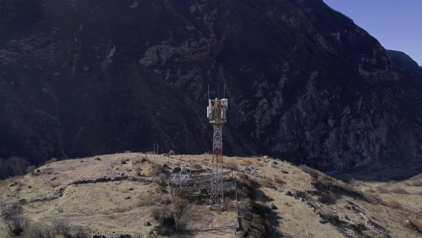 Circling around a radio tower in Langtang with solar energy in Nepal in the Himalayan mountains ...