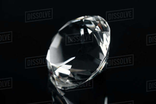 Pure expensive diamond isolated on black - Stock Photo - Dissolve