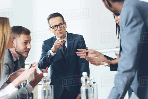 Group of multiethnic businesspeople having conversation in conference ... Group of multiethnic businesspeople having conversation in conference ...