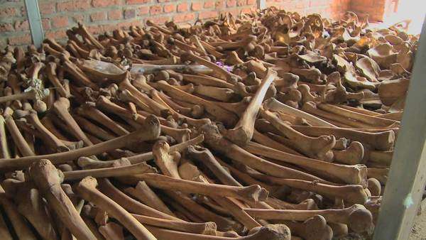 Leg bones of skeletons in long rows offer a grim remembrance of the ...