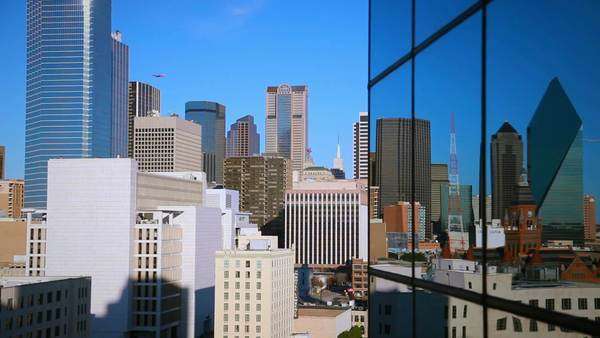 Close up footage of Dallas skyline reflection in skyscraper windows ...