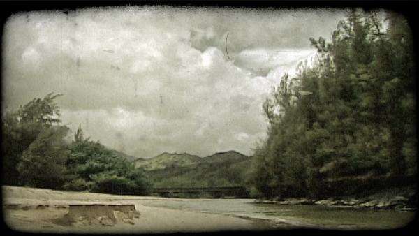 Sandy ravine area near beach on Hawaiian island with clear water ...