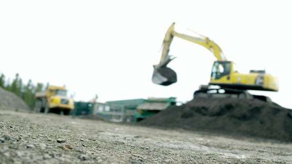 Long shot of dump truck arriving and being loaded - Stock Video Footage ...