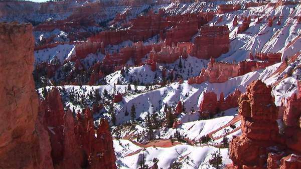Wide shot of snow covered Claron formations in Bryce Canyon National ...