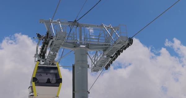 Cable car over ski valley - 4K Royalty-free Stock Video Footage | Dissolve