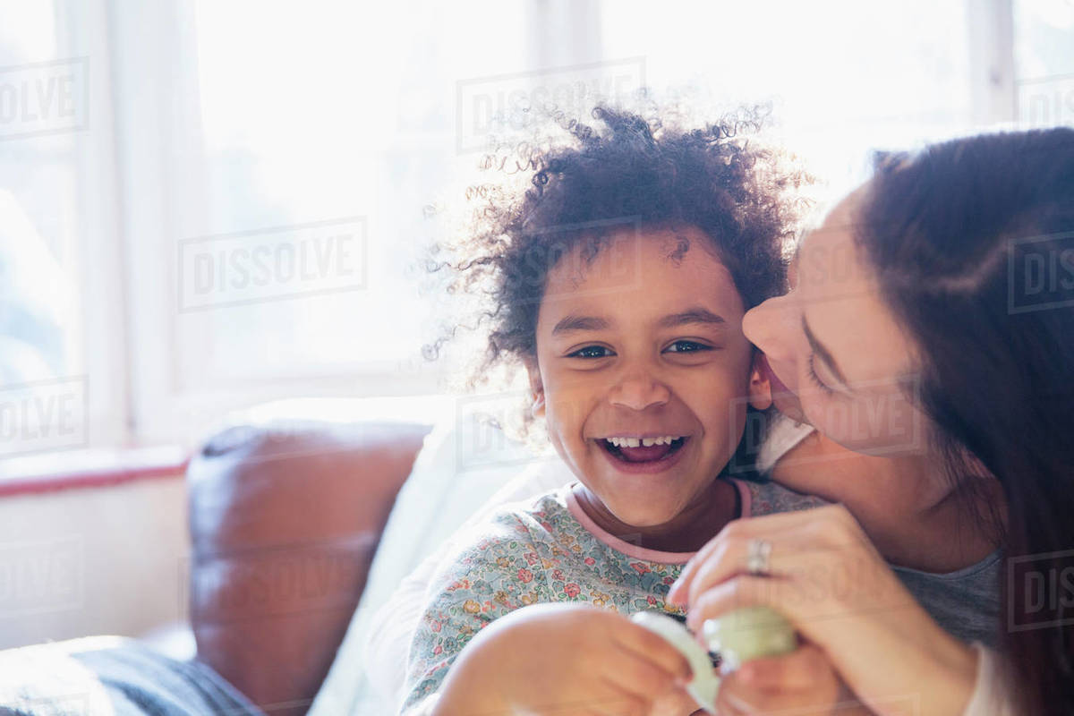 Portrait happy, affectionate mother and daughter - Royalty-free Stock Photo | Dissolve