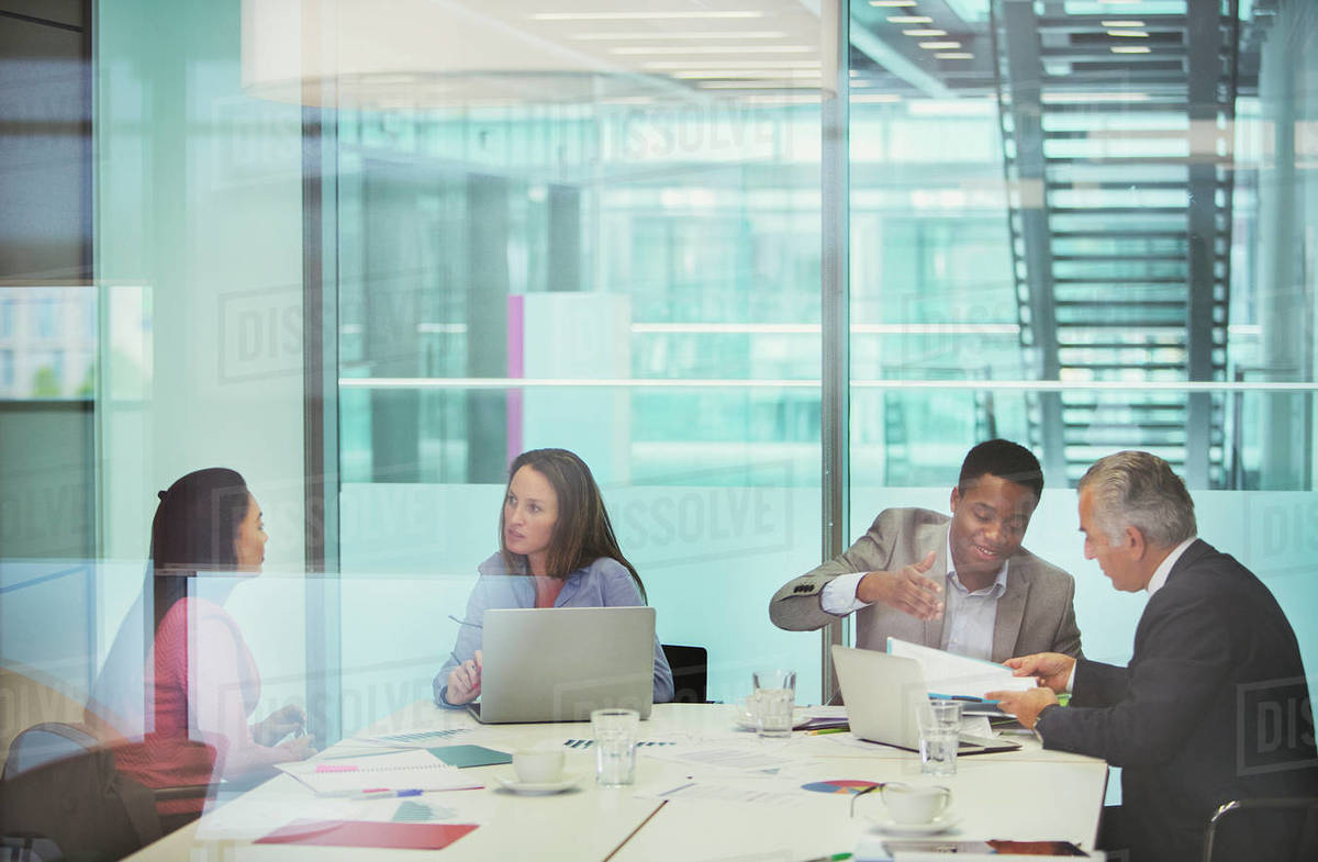 Business people talking in conference room meeting - Stock Photo - Dissolve