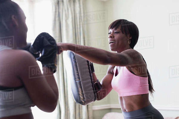 Mother and daughter boxing - Royalty-free Stock Photo | Dissolve
