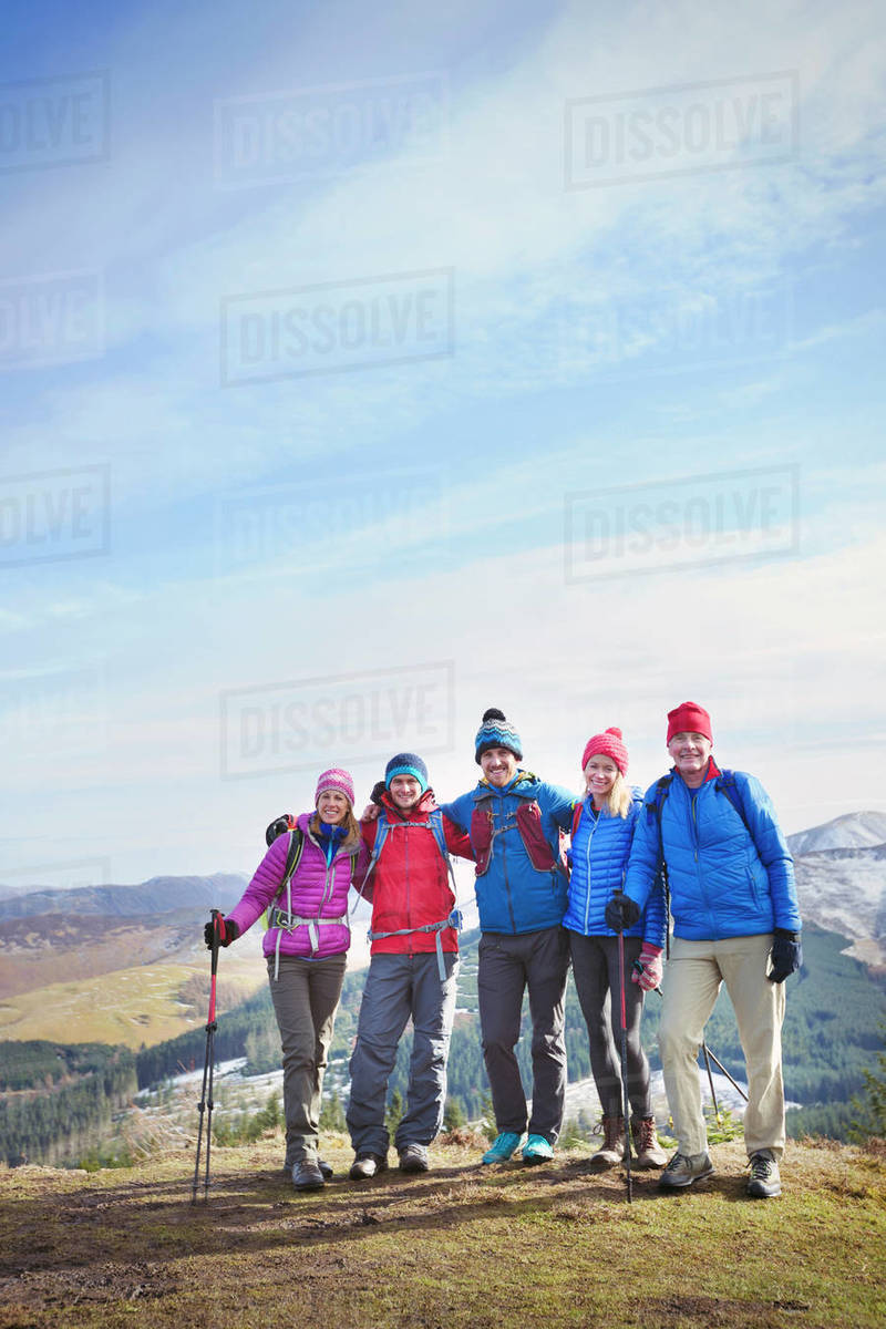 Portrait family hiking on mountain - Stock Photo - Dissolve