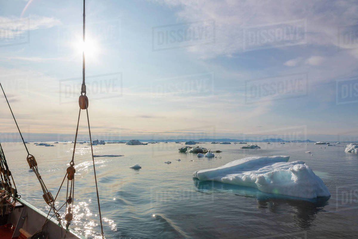 Ship sailing past melting ice on sunny Atlantic Ocean Greenland - Stock ...