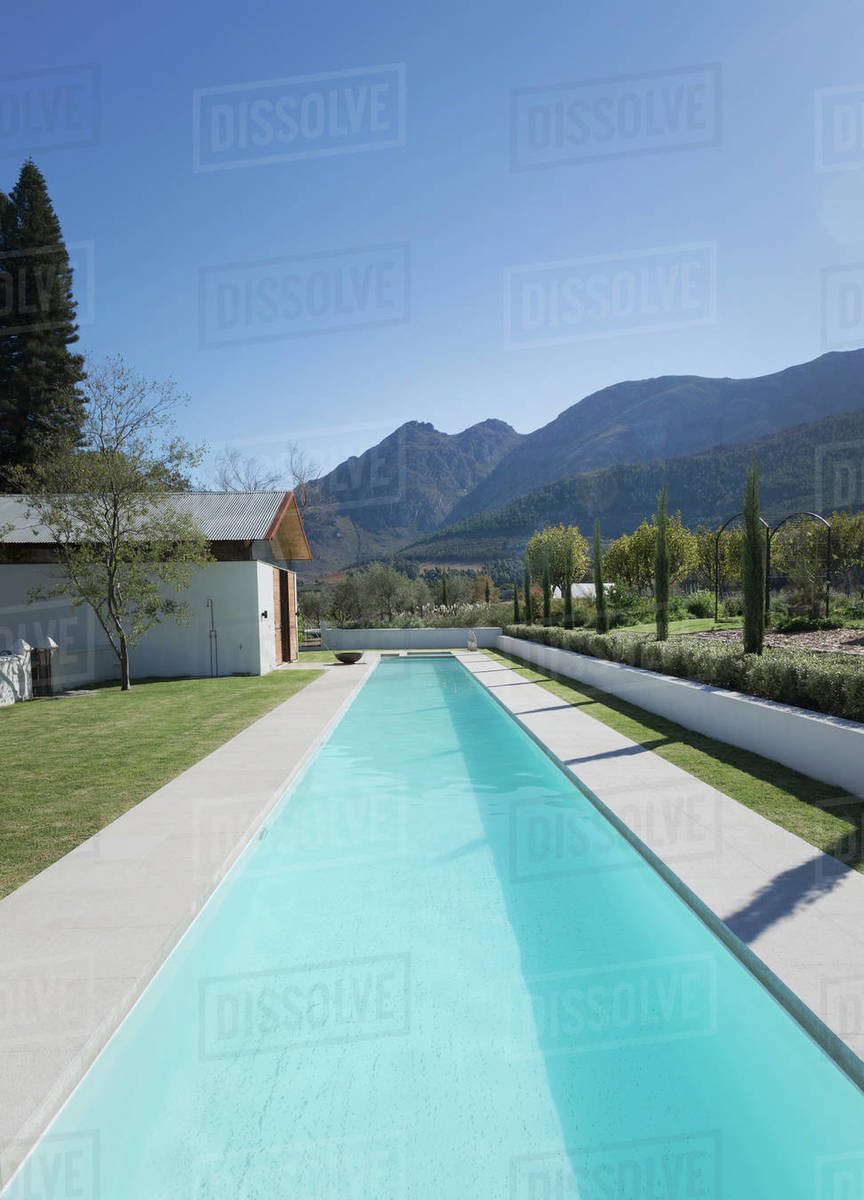 Luxury sunny lap pool with mountains in background - Royalty-free Stock ...