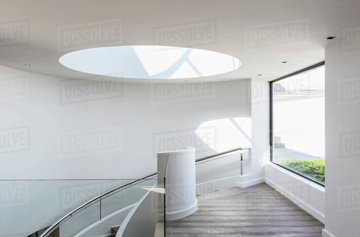 Round skylight at top of stairs in home showcase interior - Royalty ...