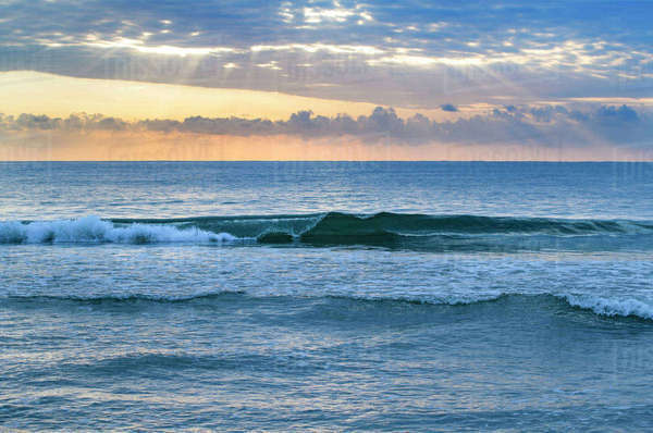 USA, Florida, Ocean waves at sunset - Royalty-free Stock Photo | Dissolve