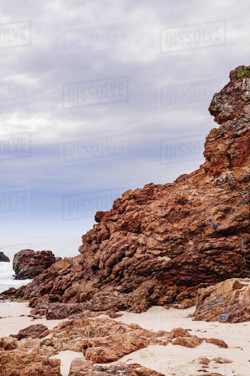 Australia, New South Wales, Rock formation on sandy beach - Royalty ...