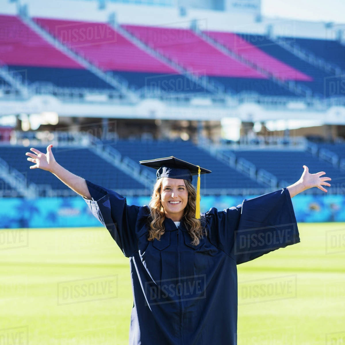 Portrait of graduate student in stadium - Royalty-free Stock Photo ...