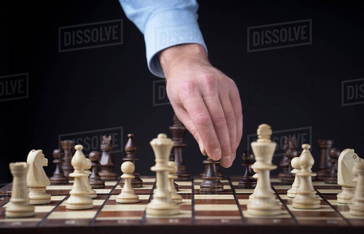 Hand of man playing chess - Royalty-free Stock Photo | Dissolve
