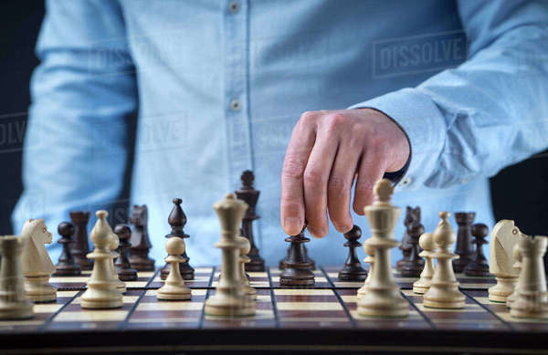 Hand of man playing chess - Royalty-free Stock Photo | Dissolve