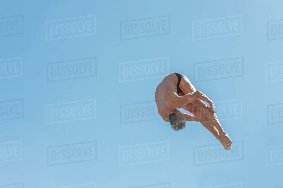 Athletic swimmer jumping - Royalty-free Stock Photo | Dissolve