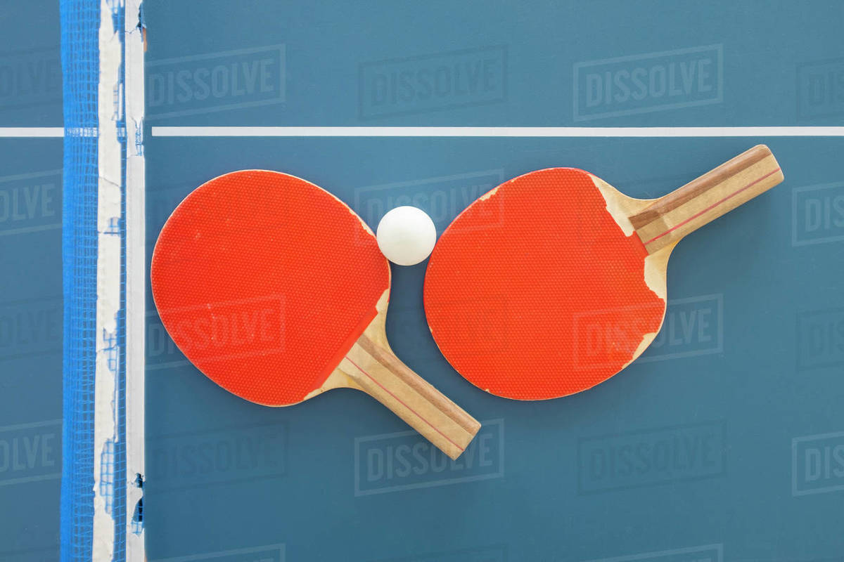 Ping pong paddles and ball on table - Royalty-free Stock Photo | Dissolve