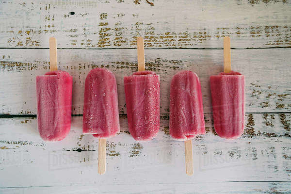 Row of berry ice pops - Stock Photo - Dissolve