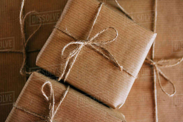 Presents wrapped in brown paper and string - Royalty-free Stock Photo ...