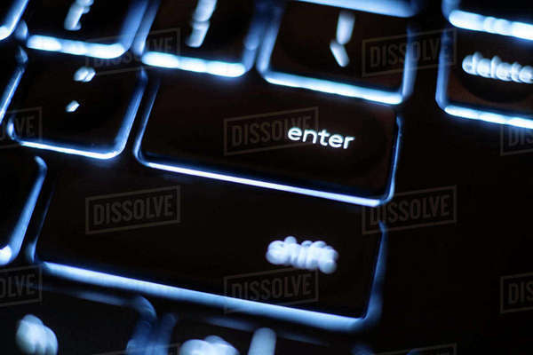Illuminated 'enter' key on keyboard - Royalty-free Stock Photo | Dissolve