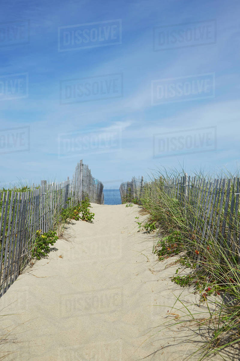 Wooden fence and path to beach - Royalty-free Stock Photo | Dissolve