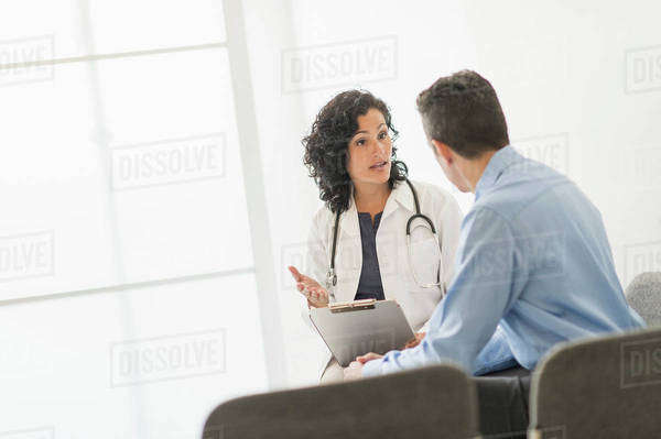 Doctor talking to patient - Stock Photo - Dissolve