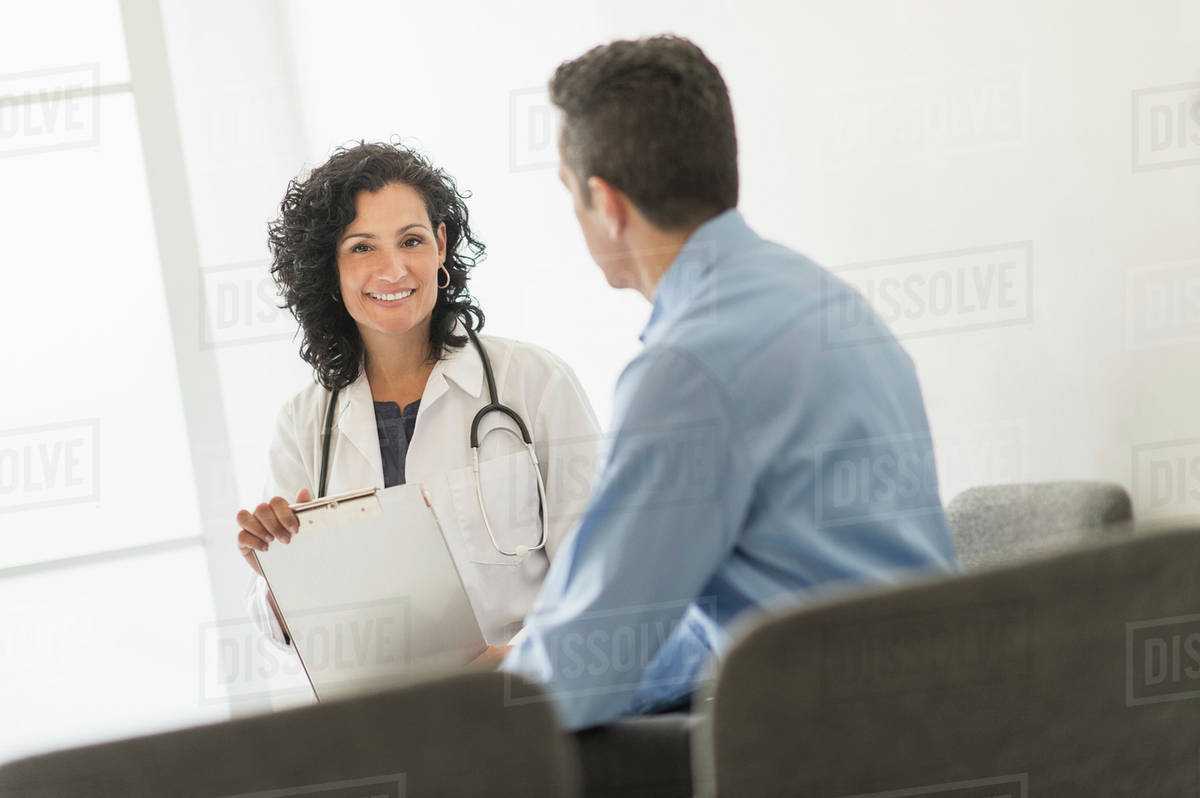Doctor talking with patient - Royalty-free Stock Photo | Dissolve