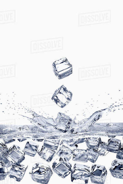 Ice cubes falling into water - Royalty-free Stock Photo | Dissolve