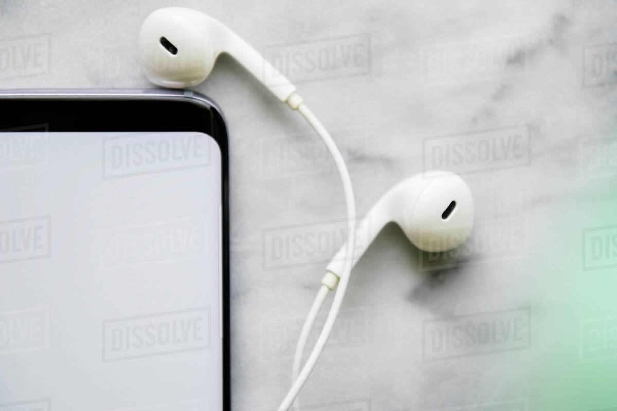 Earphones and smart phone - Royalty-free Stock Photo | Dissolve