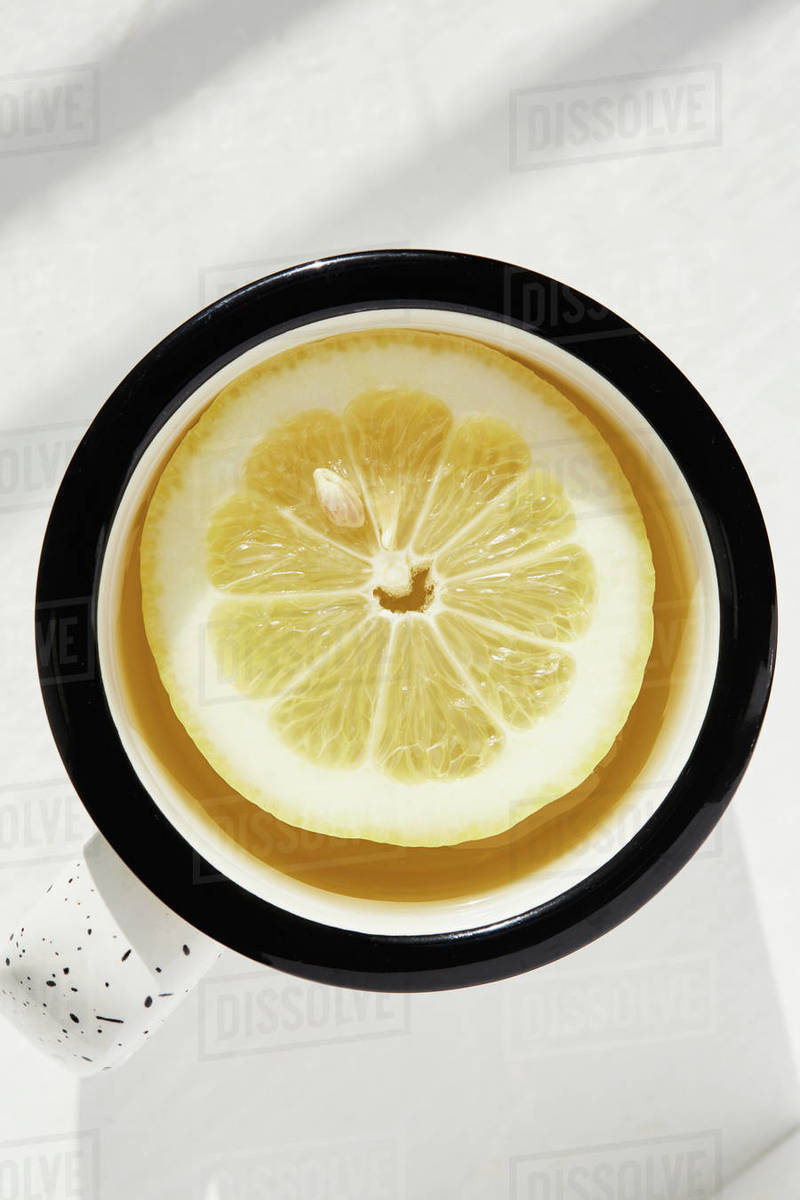 Lemon slice in cup of tea - Royalty-free Stock Photo | Dissolve