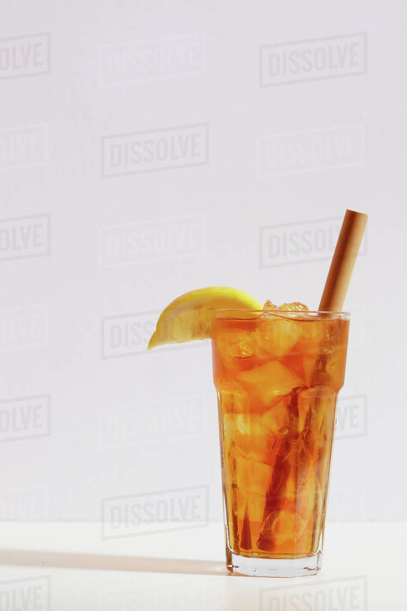 Iced tea in cup with sliced lemon - Royalty-free Stock Photo | Dissolve