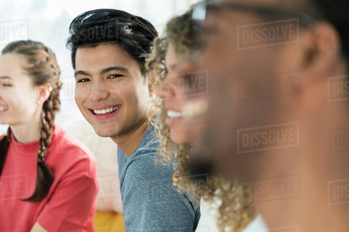 Group of friends laughing together - Stock Photo - Dissolve