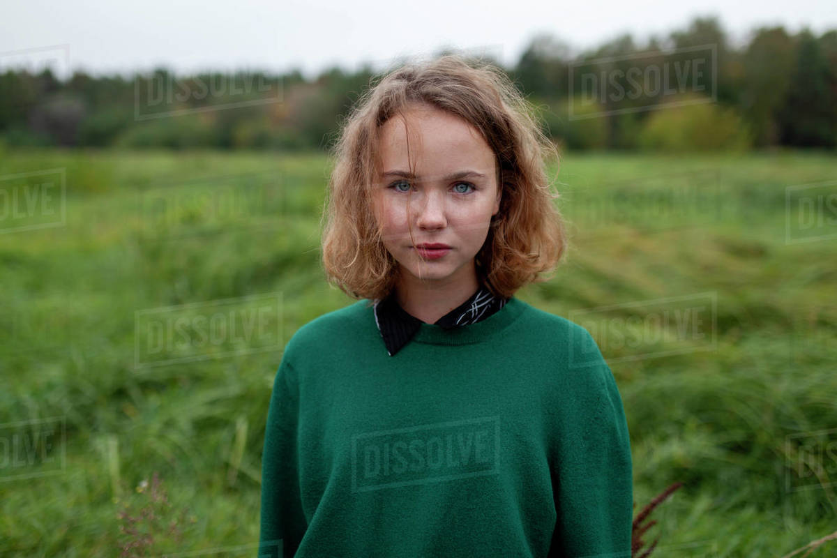 Russia, Omsk, Portrait of teenage girl in meadow - Royalty-free Stock ...