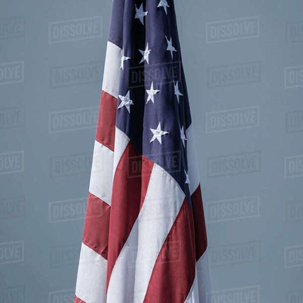 American flag on grey background - Stock Photo - Dissolve