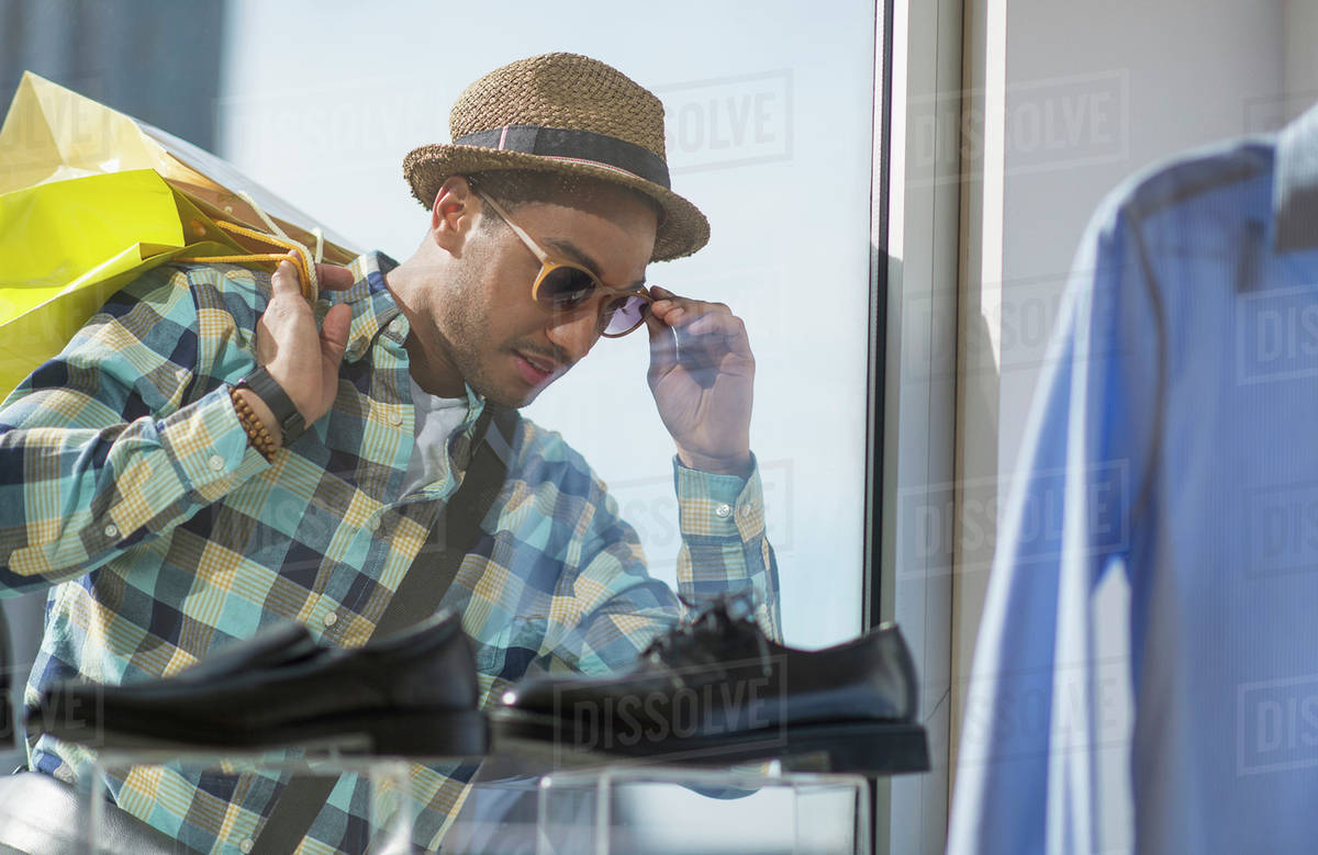 Stylish man window shopping - Stock Photo - Dissolve