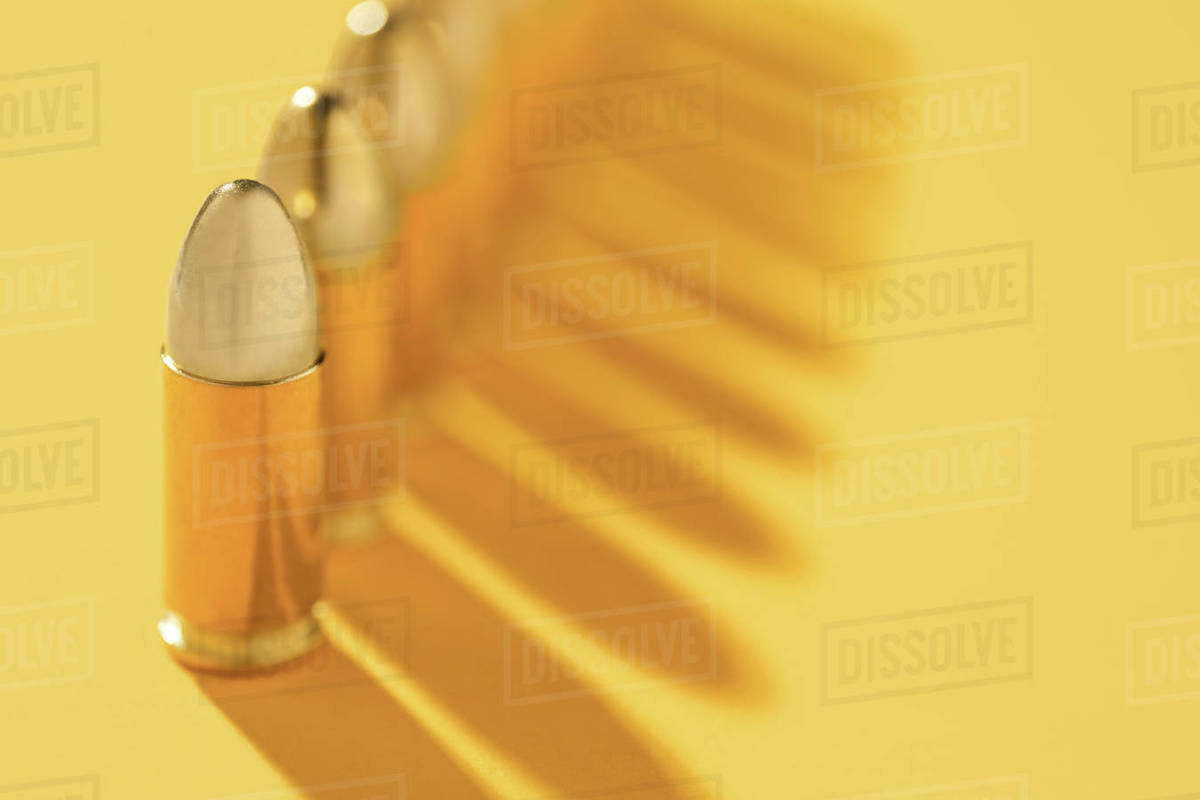 Row of gold bullets on yellow background - Royalty-free Stock Photo ...