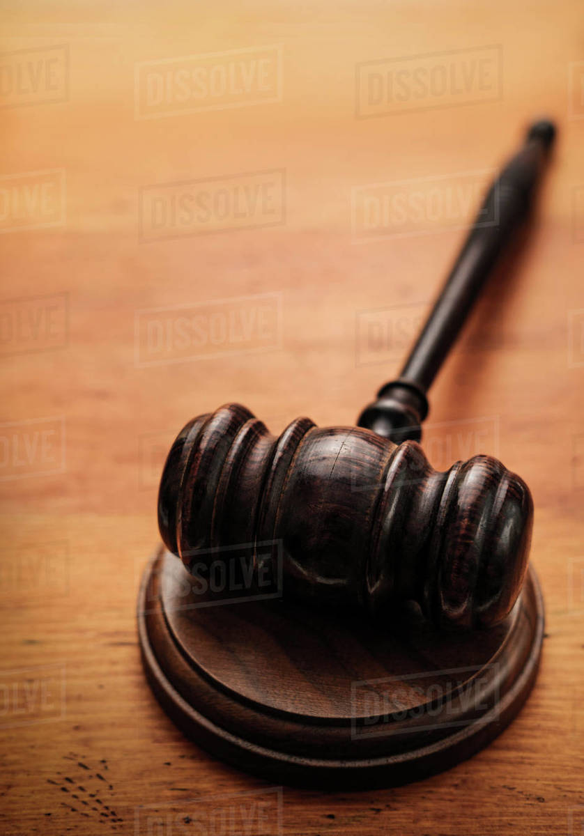 Gavel on wooden background - Stock Photo - Dissolve