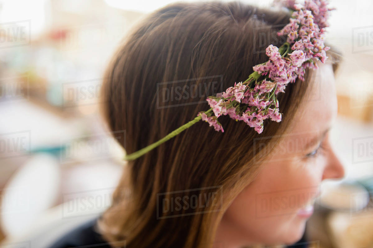 Woman with flowers on head - Royalty-free Stock Photo | Dissolve