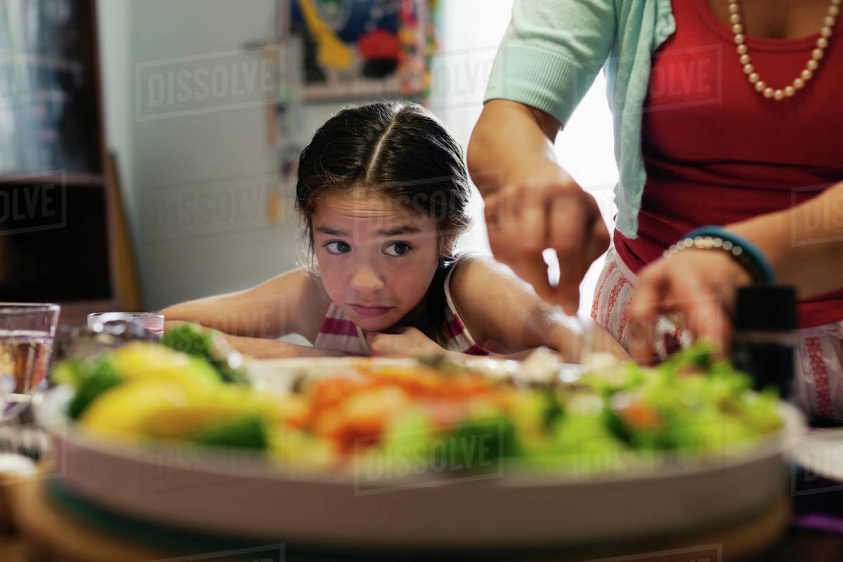 Girl waiting for food - Royalty-free Stock Photo | Dissolve