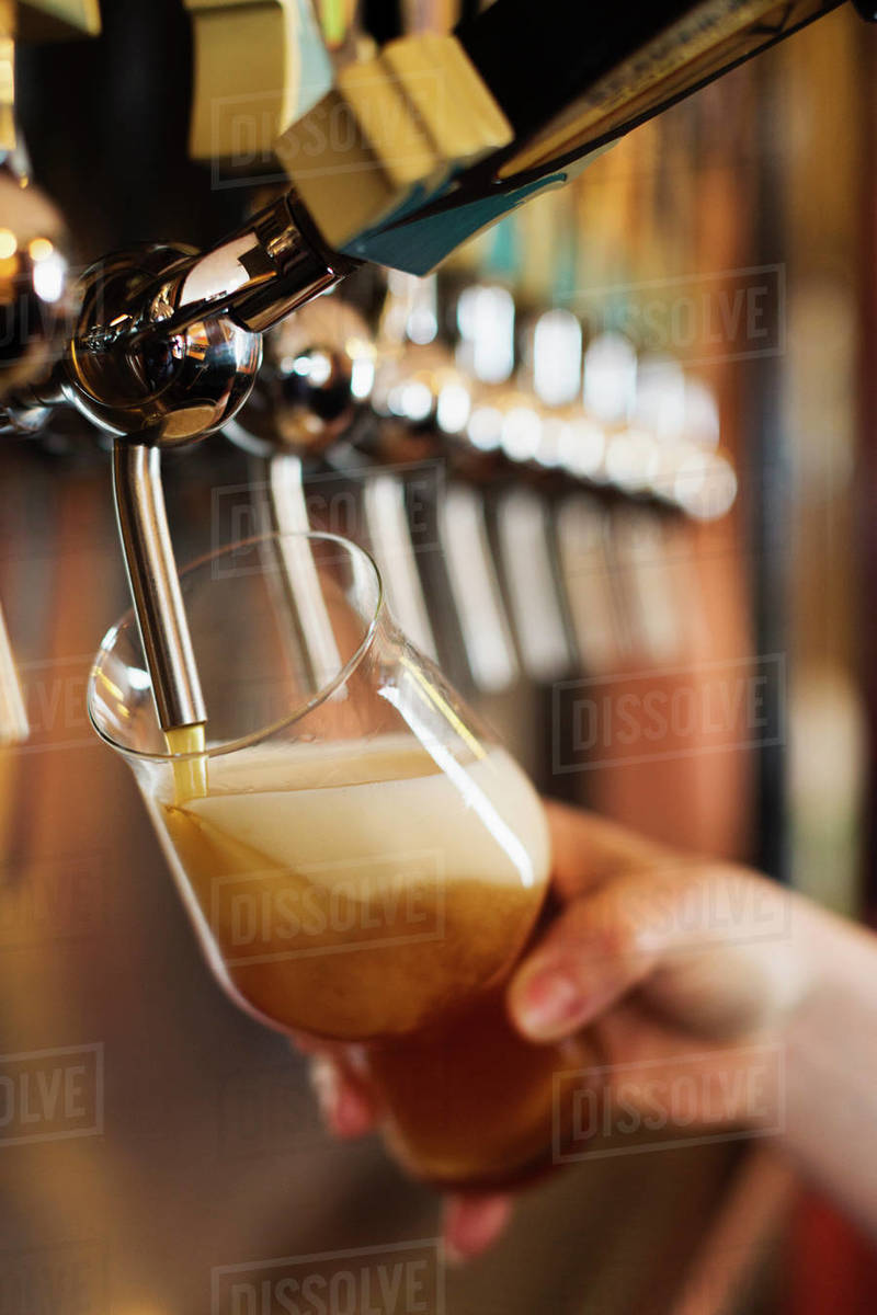Beer being poured - Stock Photo - Dissolve