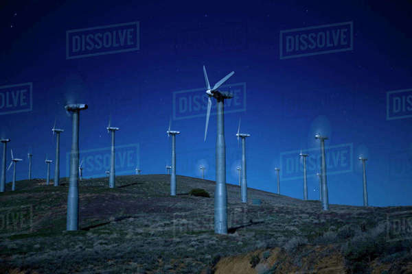 Wind turbines in landscape at night - Royalty-free Stock Photo | Dissolve