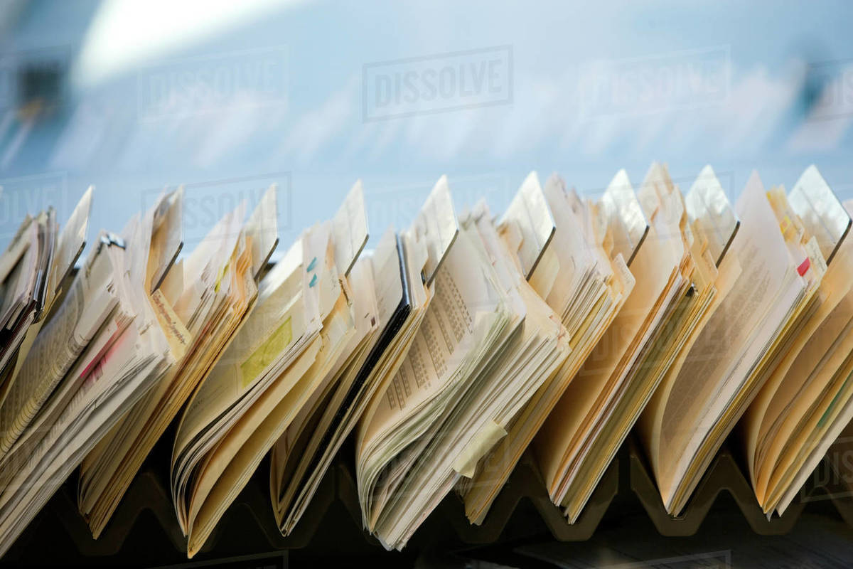 Close-up of files stacked on desk in office - Royalty-free Stock Photo ...