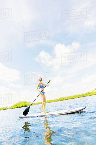 Woman on paddle board - Royalty-free Stock Photo | Dissolve