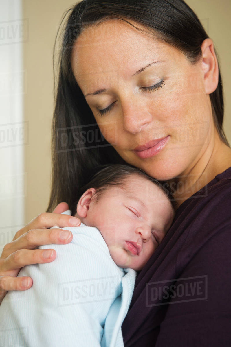 Portrait of mother holding newborn baby (0-11 months) - Royalty-free ...