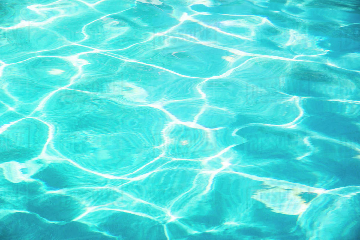 Surface of blue rippled water reflecting sunlight - Royalty-free Stock ...